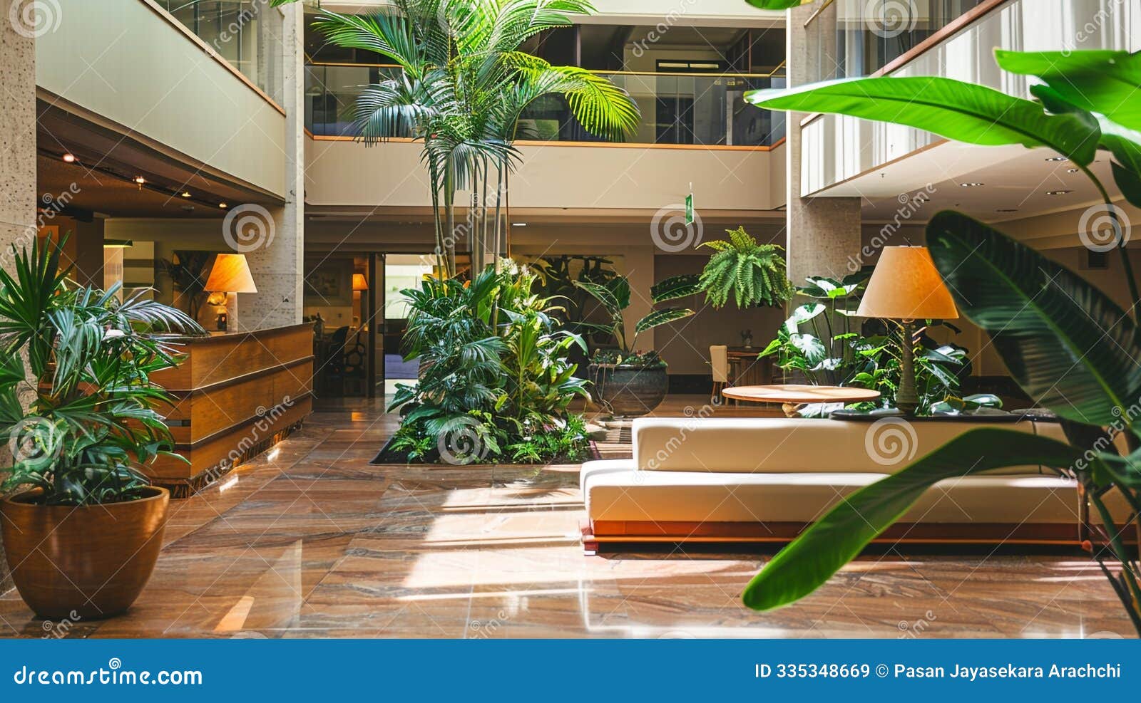 Hotel Reception Area Featuring Glass Atrium and Tropical Plants Stock ...