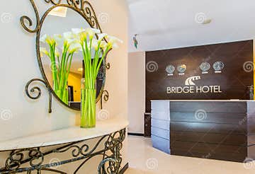 The Hotel Reception with Desk and Clocks Editorial Stock Image - Image ...