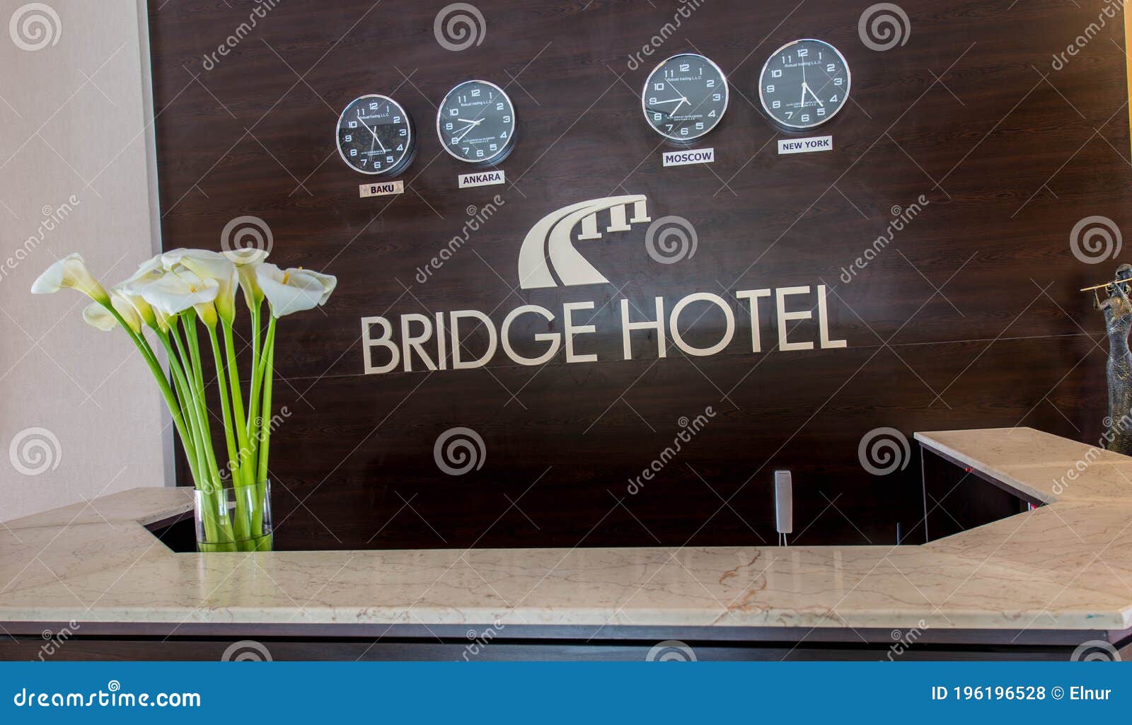 Hotel Reception with Desk and Clocks Stock Photo - Image of desk, chair ...