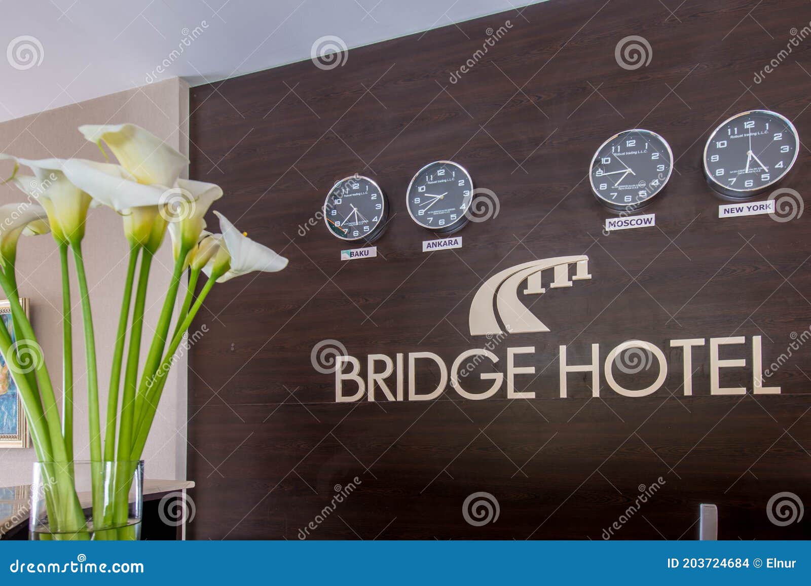 Hotel Reception with Desk and Clocks Stock Photo - Image of clocks ...