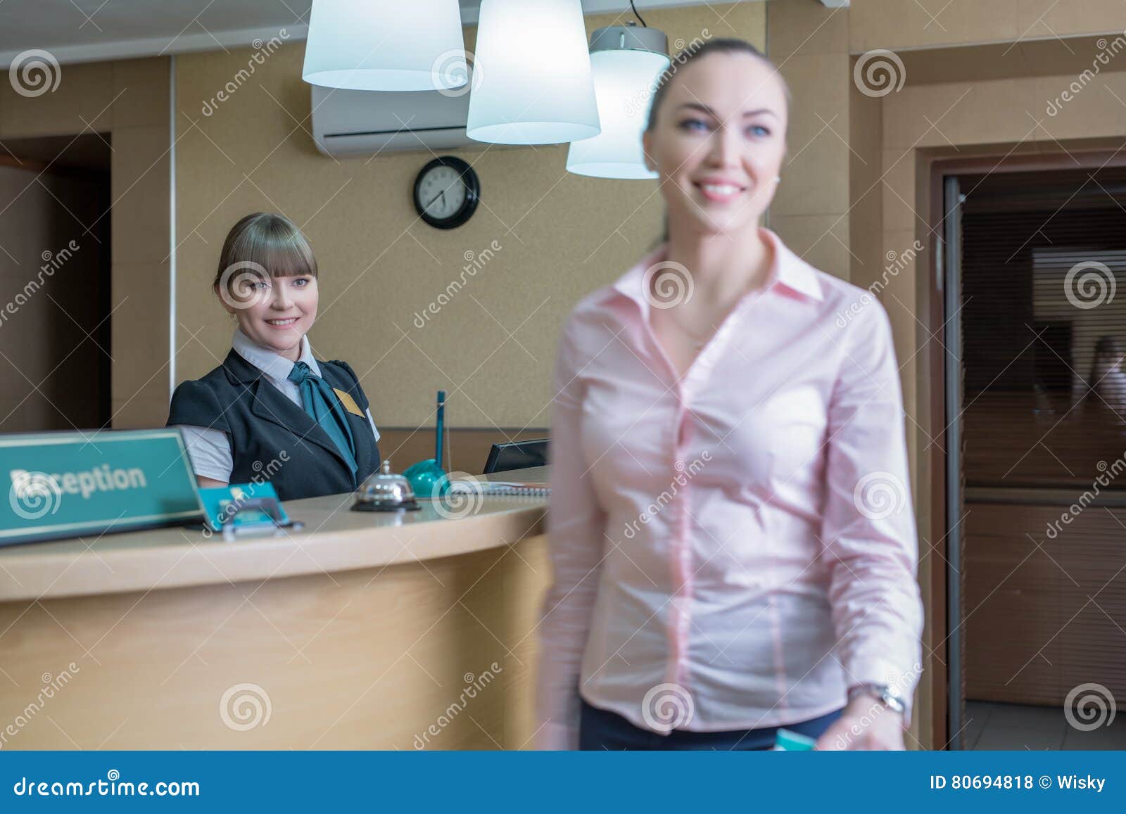 Hotel Reception. Image of Pretty Hostess and Guest Stock Photo - Image ...