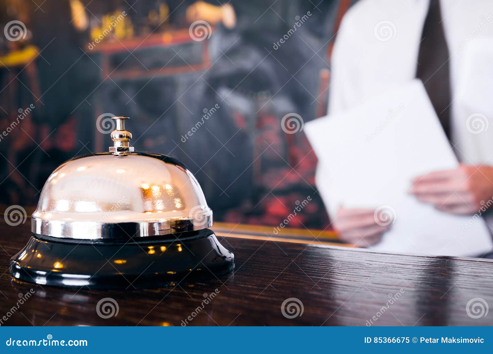 Hotel Reception Service Bell with Concierge Holding a File Stock Image ...