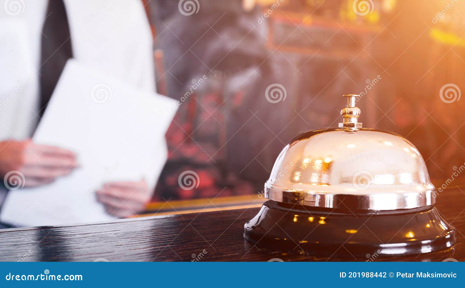 Hotel Reception Service Bell with Concierge Holding Files Stock Photo ...