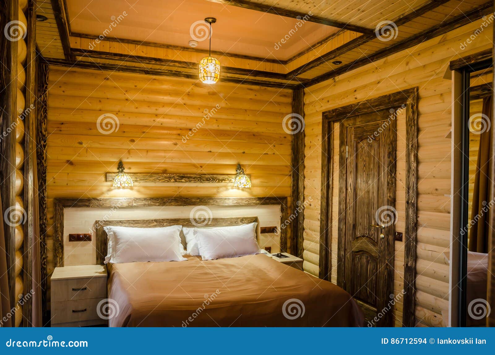 A Hotel Room or a Private Home Decorated with a Tree Decorated Rustic ...