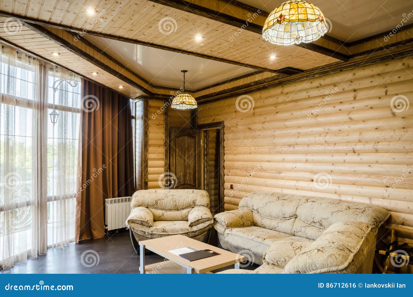 A Hotel Room or a Private Home Decorated with a Tree Decorated Rustic ...
