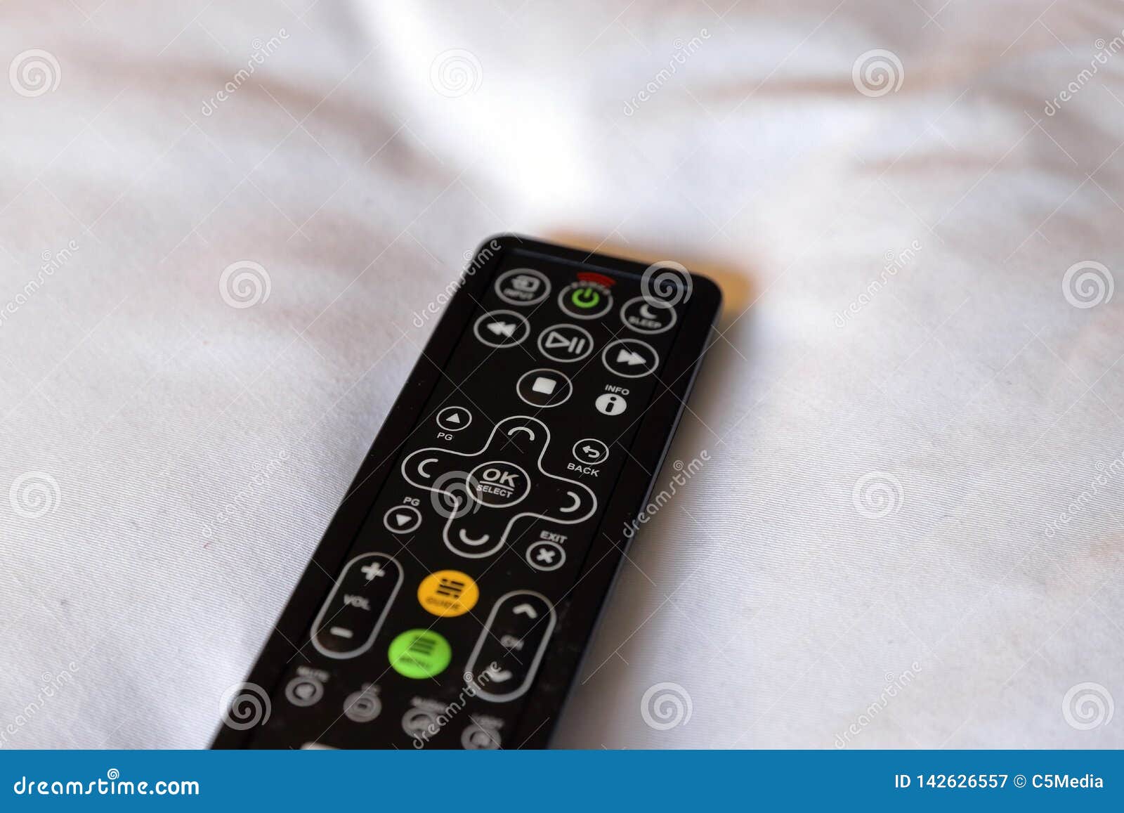 Hotel Room Remote Control on White Bedding Stock Image - Image of ...