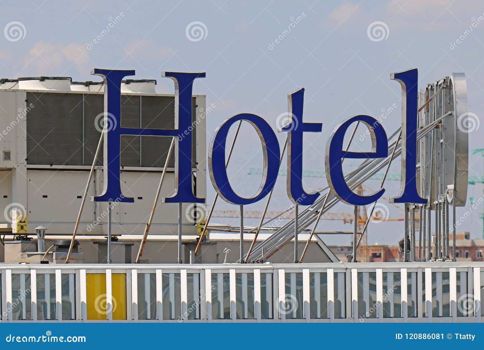 Hotel Sign on Top of Building Stock Image - Image of roof, symbol ...