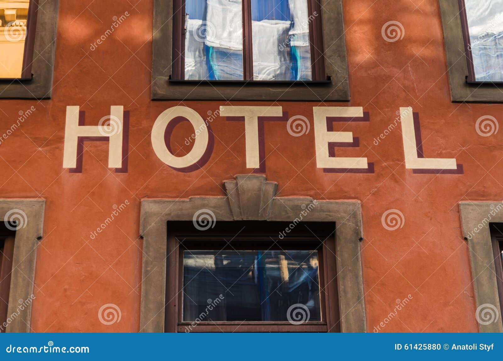 Hotel sign between windows stock photo. Image of enter - 61425880