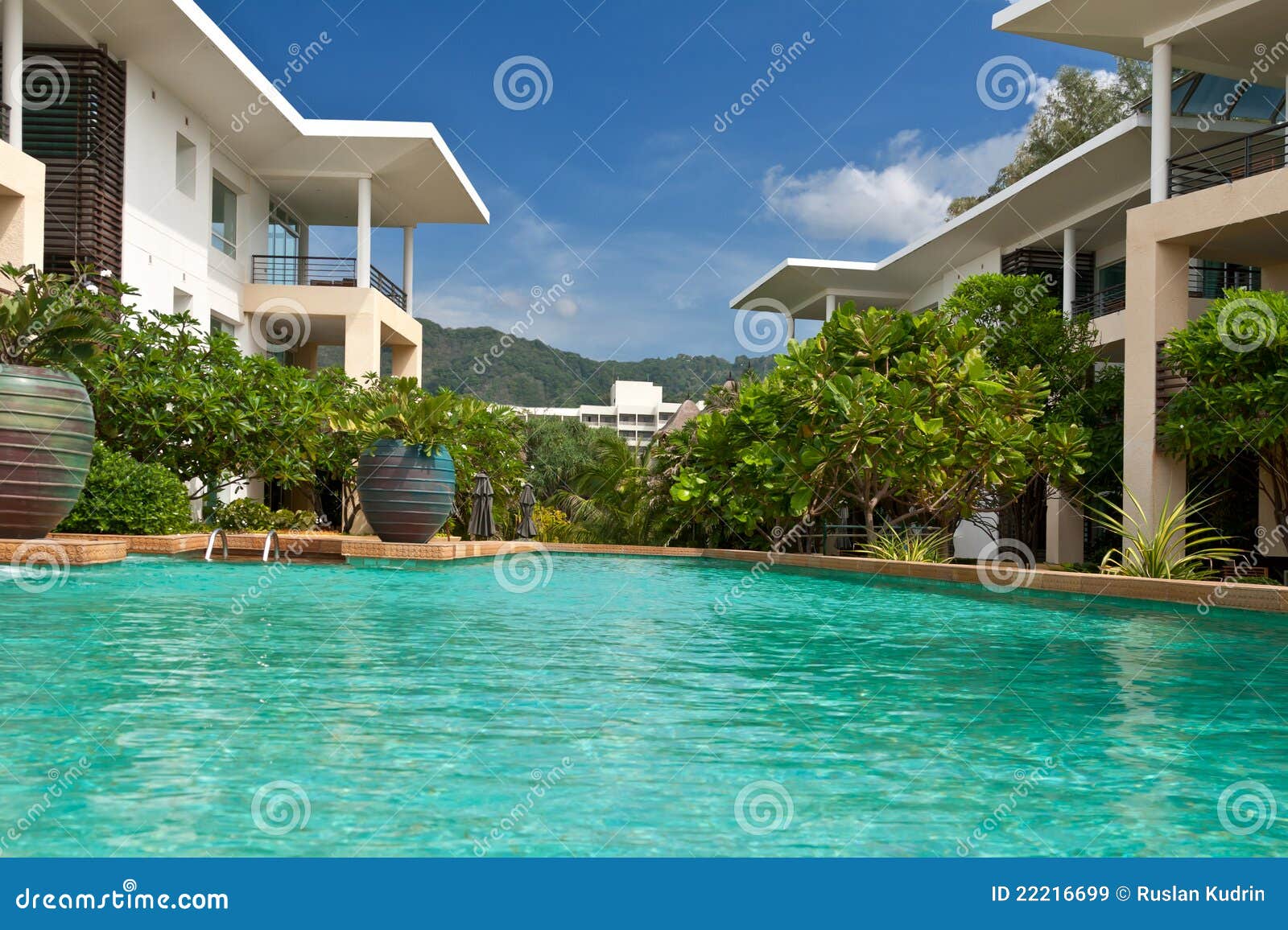 Hotel with Sky-blue Swimming Pool with Palm Trees Stock Image - Image ...