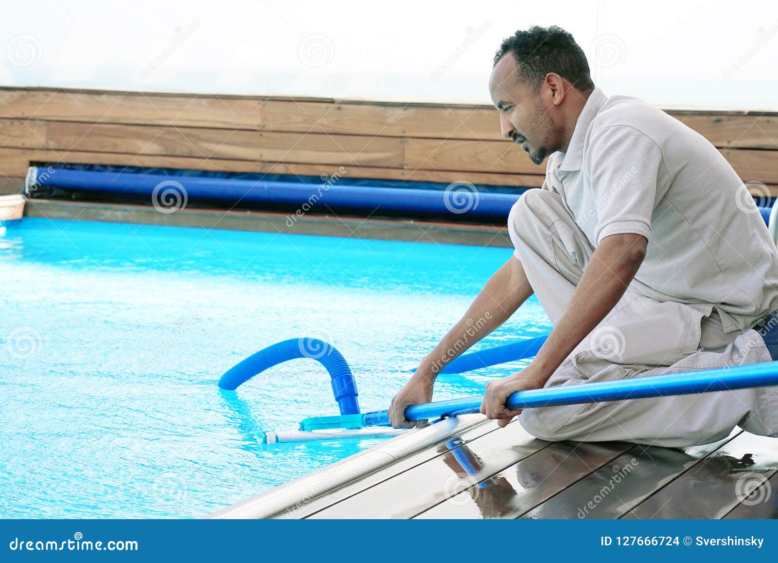 Hotel Staff Worker Cleaning the Pool. Maintenance. Stock Photo - Image ...