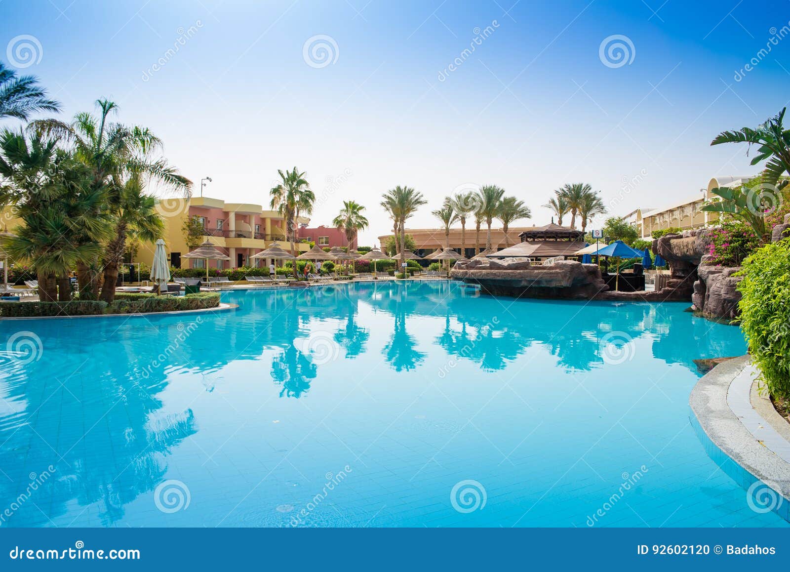 Hotel with swimming pool stock photo. Image of lounge - 92602120
