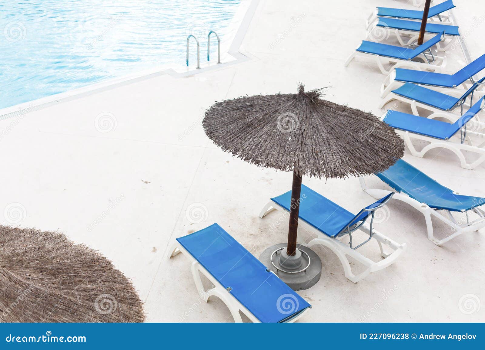 Hotel Swimming Pool with Empty Sun Loungers Stock Photo - Image of ...