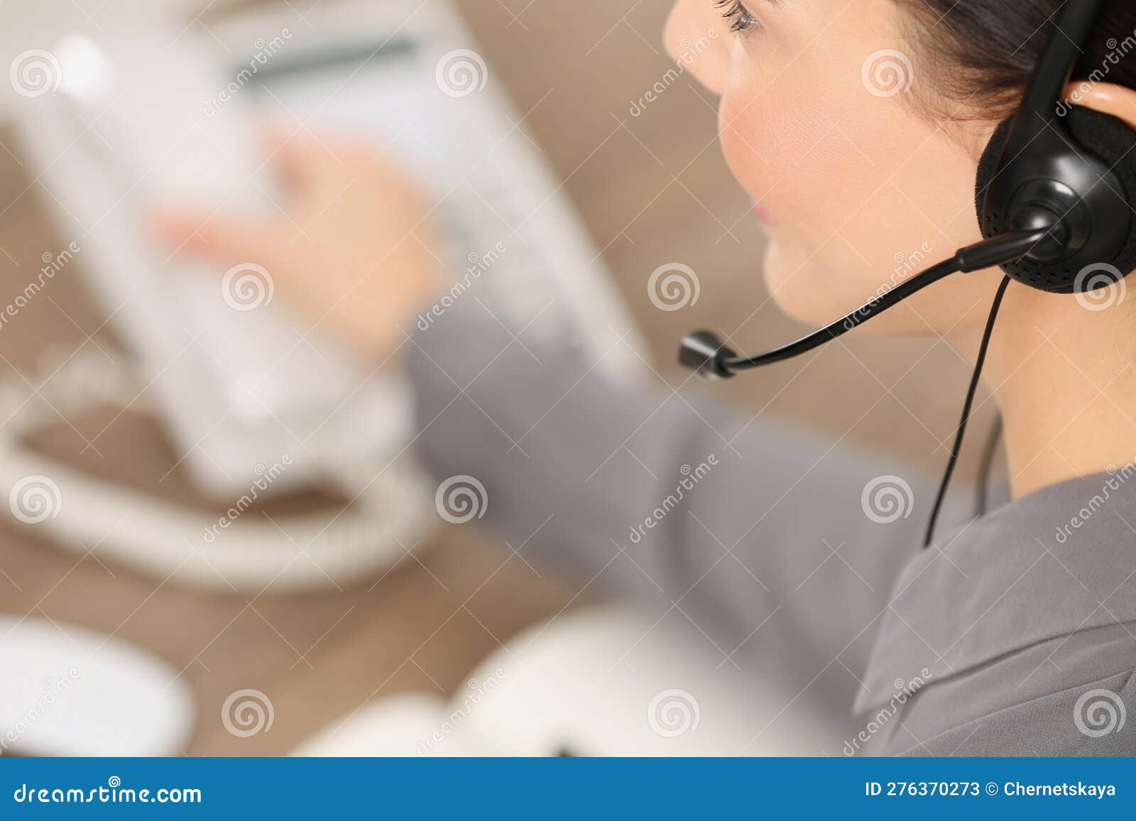 Hotline Operator with Headset and Stationary Phone Working in Office ...