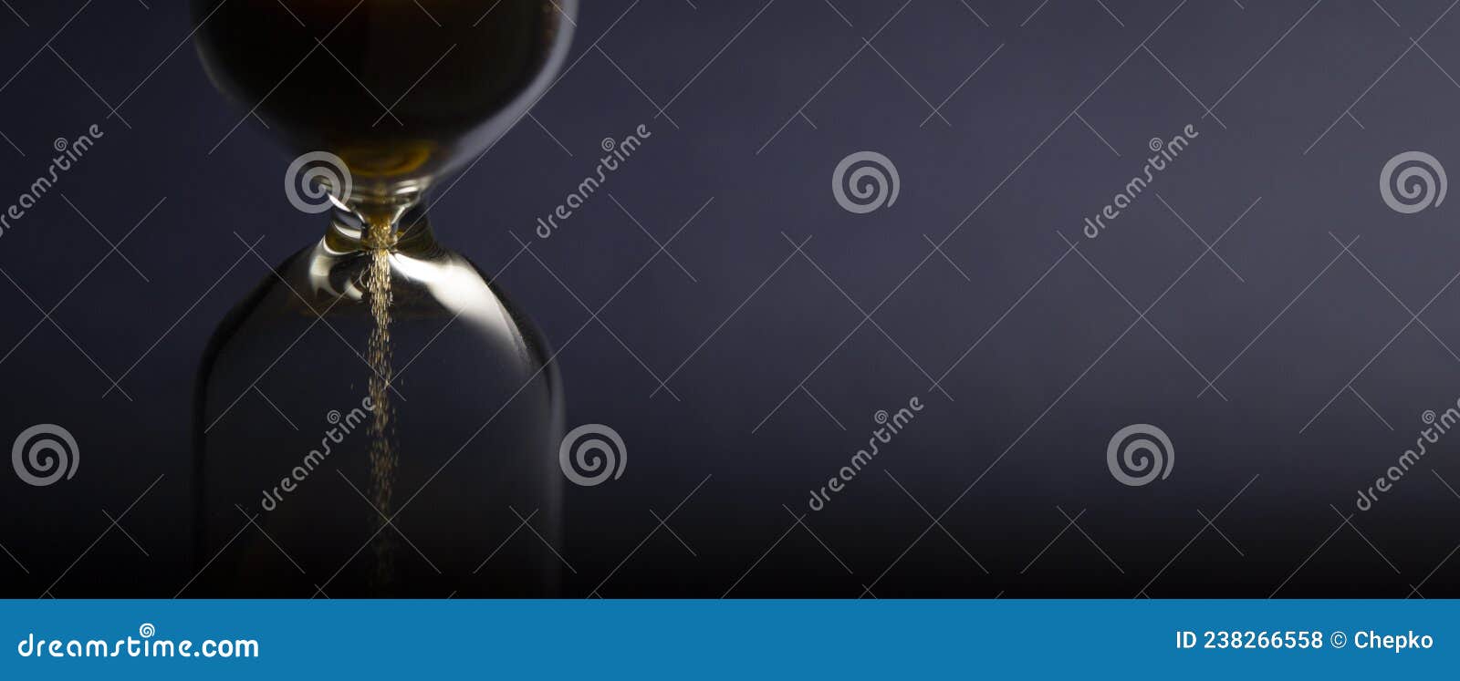 Hour Glass with Running Sand Inside, on Blue Background. Time Passing ...