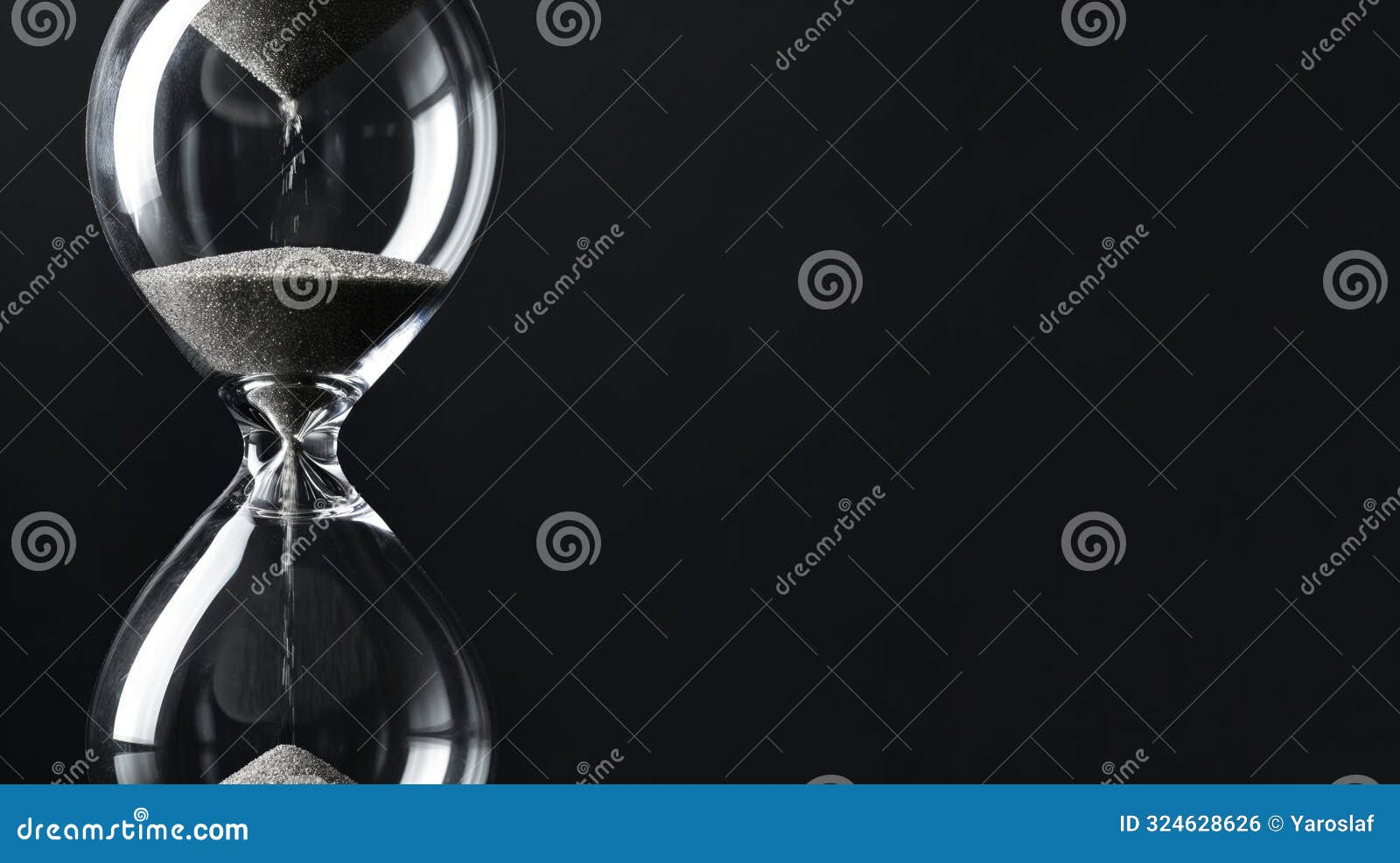 Hourglass With Black Sand Against A Dark Background The Image Captures The Flow Of Time And The