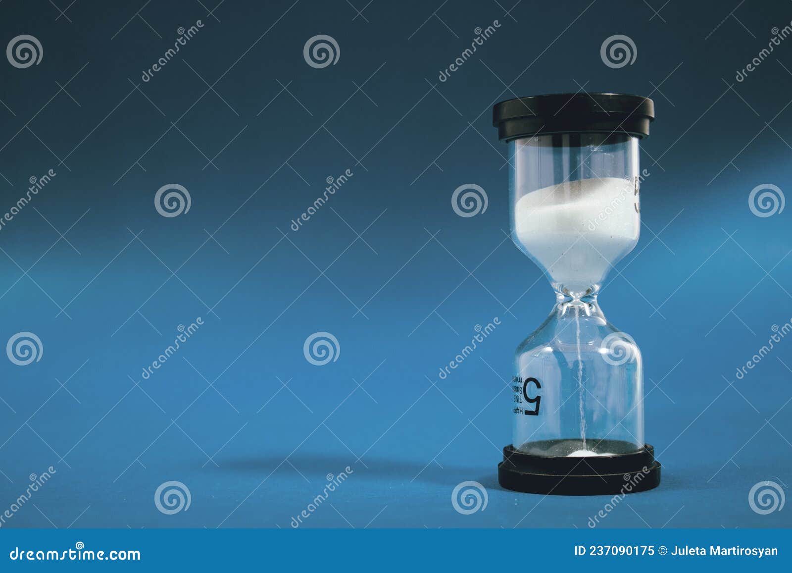 Hourglass on Blue Background Stock Image - Image of deadline, time ...