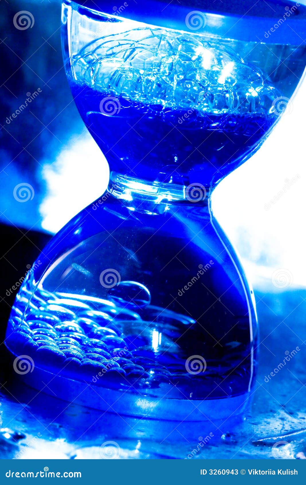 Hourglass in blue color stock image. Image of instant - 3260943