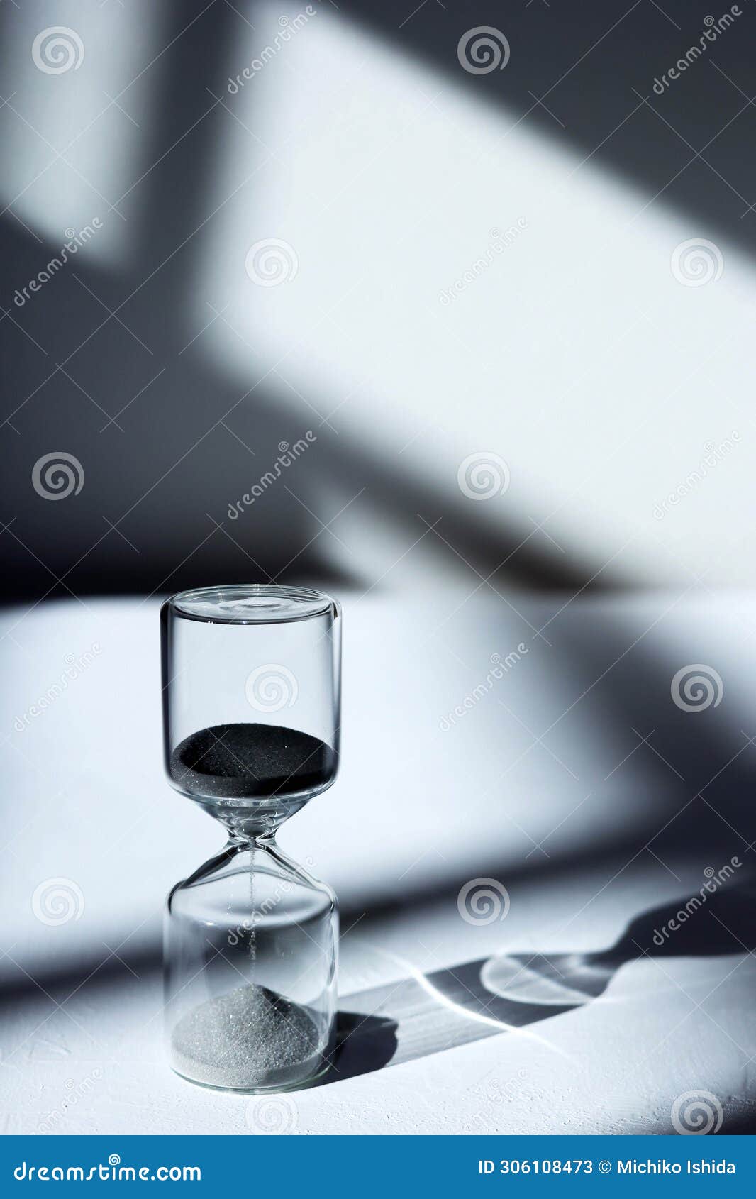 Hourglass on the Desk Striking Light, Shadow and Glass Reflections ...