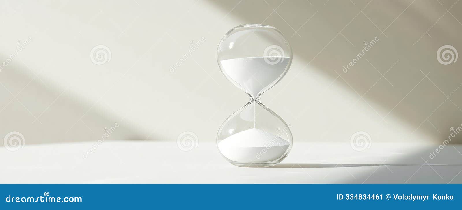 Hourglass with Flowing White Sand on a Light Background, Symbol of Time ...