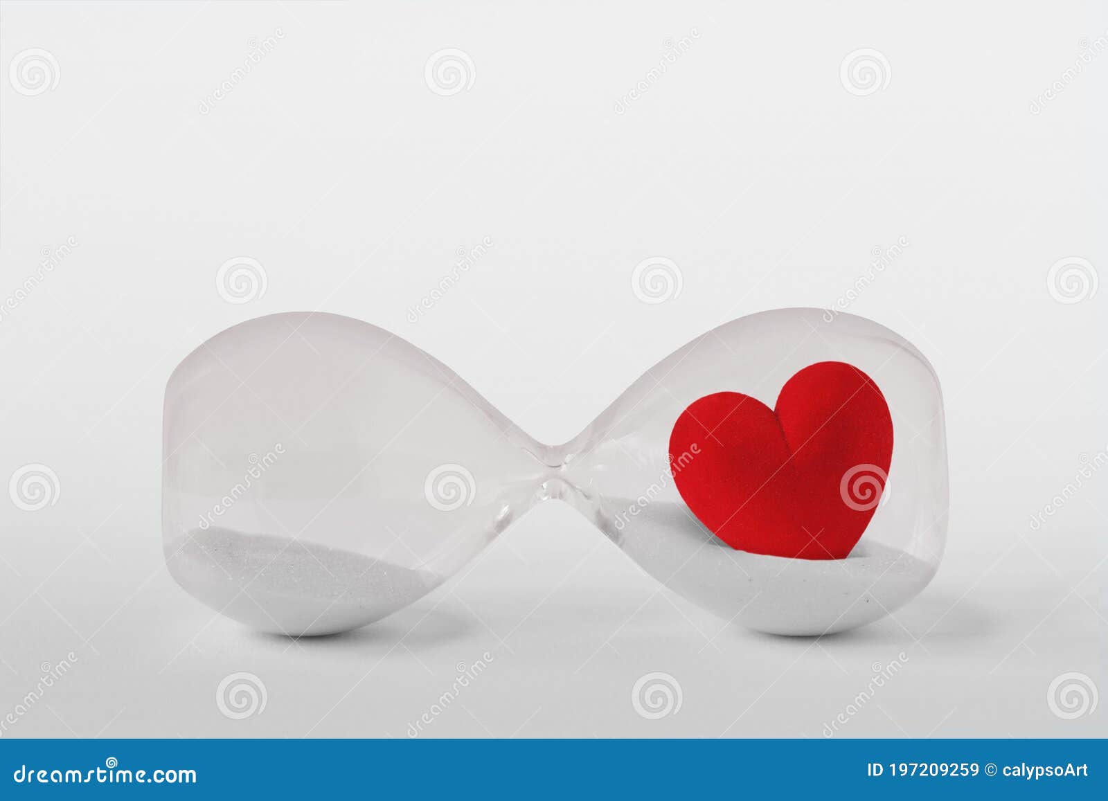 Hourglass with Heart Lying on White Background - Concept of Time and ...