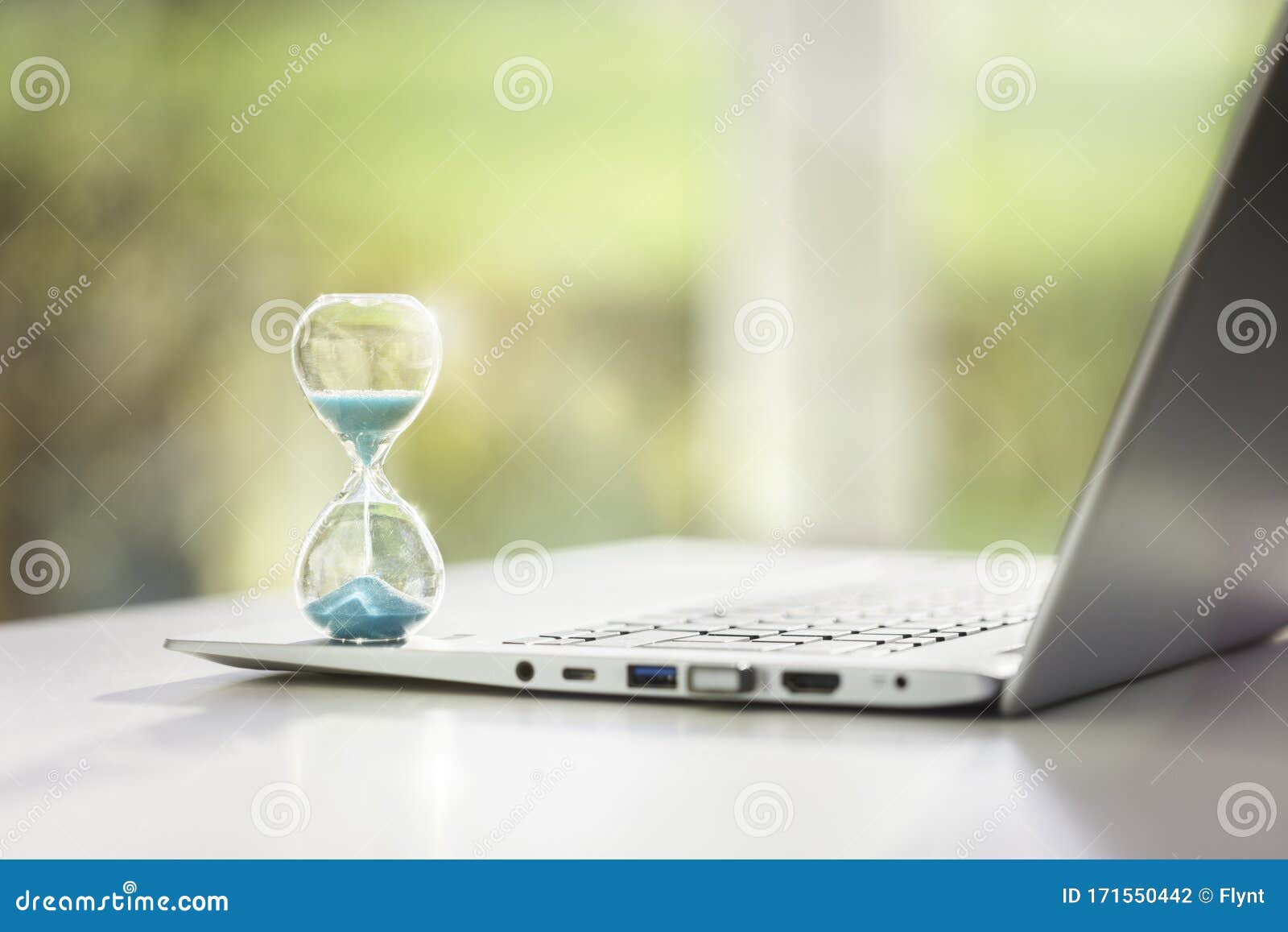 Hourglass on Laptop Computer Concept for Time Management Stock Photo ...