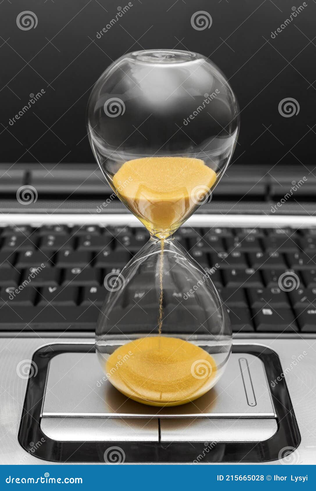 Hourglass on Laptop Keyboard. Close Up Stock Photo - Image of workplace ...