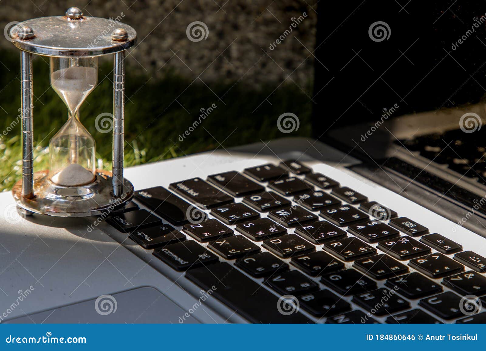 Hourglass on Laptop Keyboard. Time Management Concept Stock Photo ...