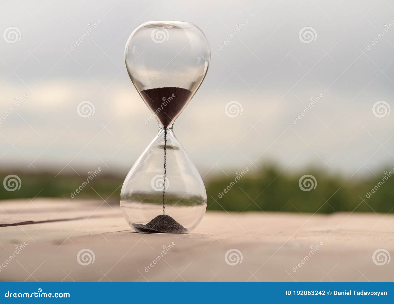 Hourglass in nature stock photo. Image of nature, concept - 192063242