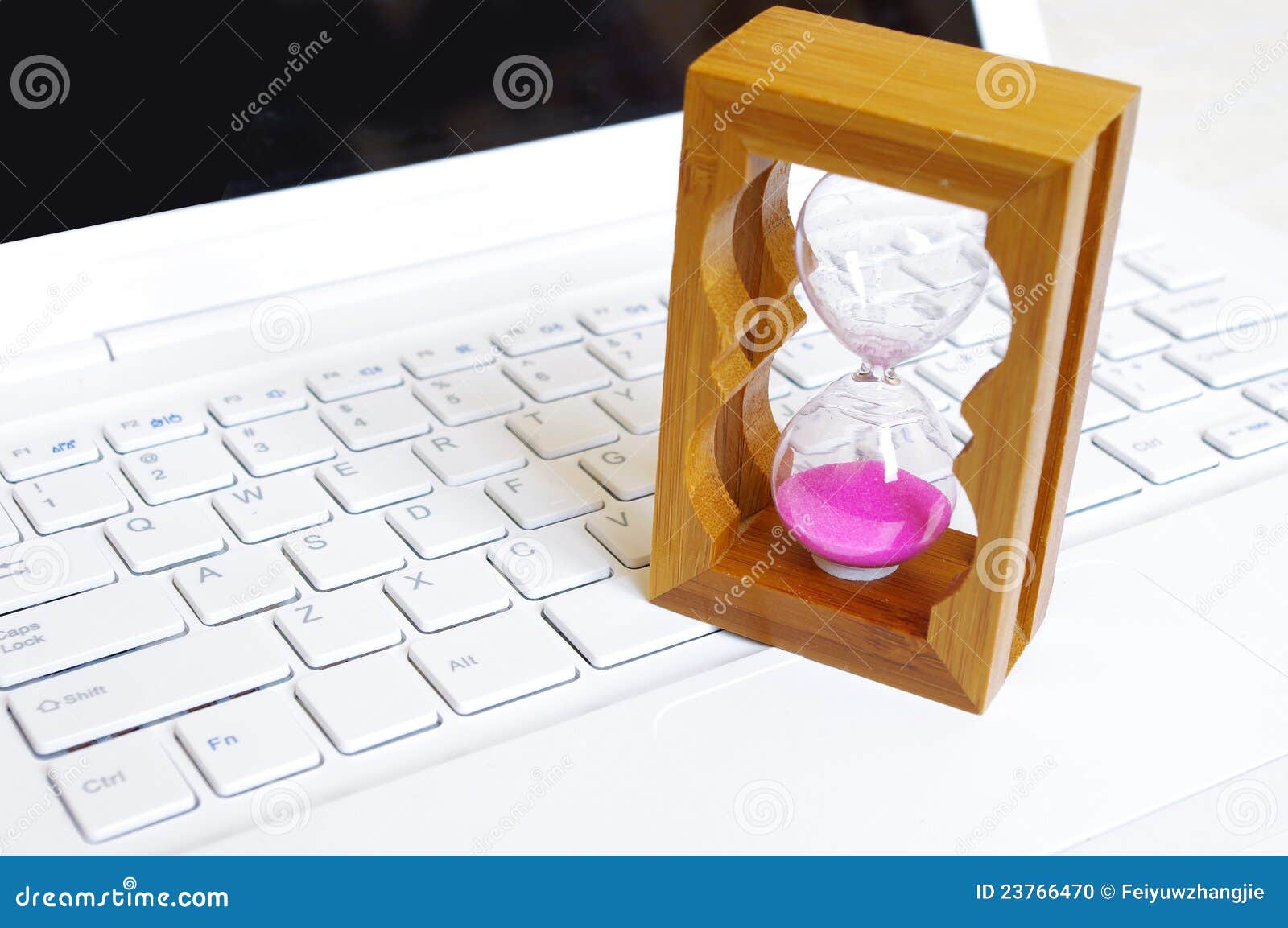Hourglass and Notebook Computers Stock Photo - Image of laptop, office ...