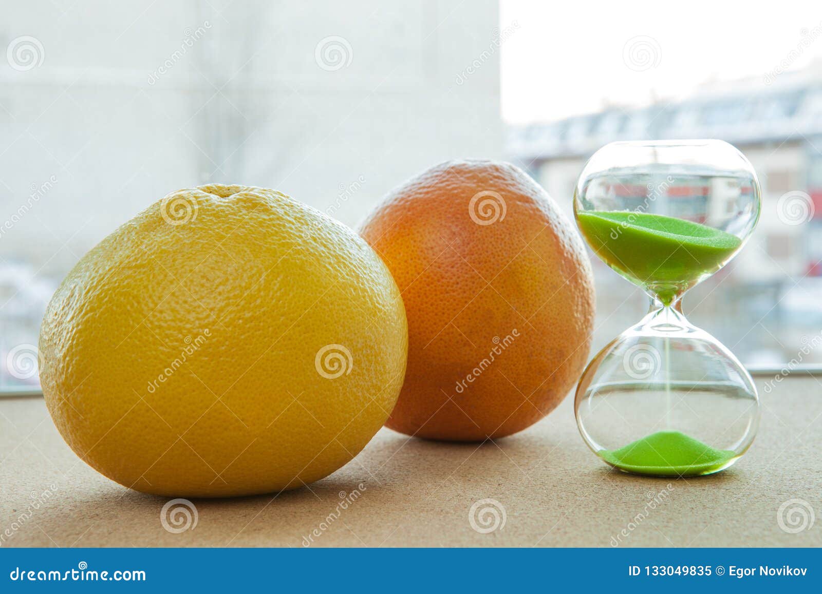 Hourglass with Orange in the Background, Close-up Stock Image - Image ...