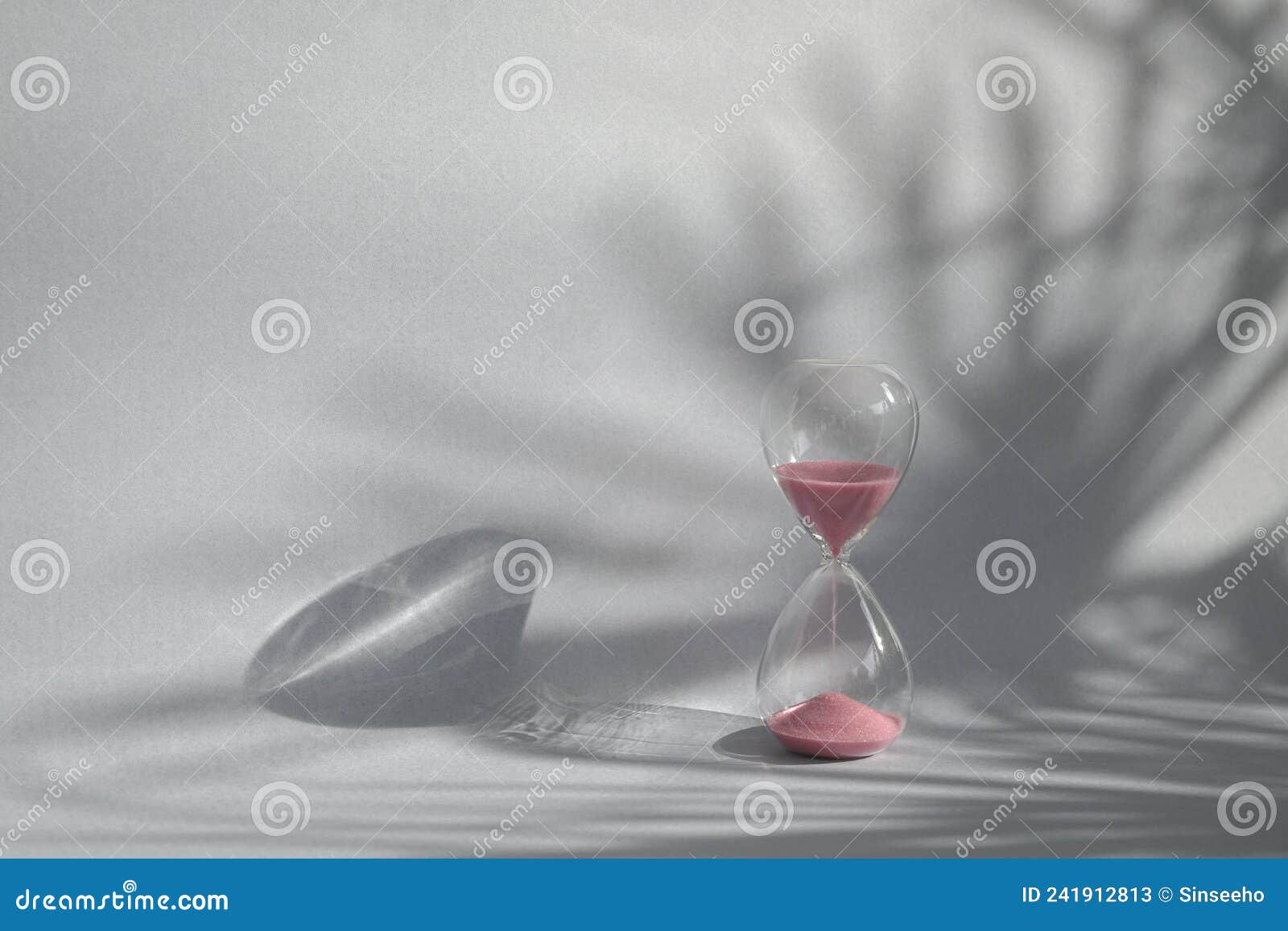 Hourglass On Sand Beach With Sunset Sky Background Royalty-Free Stock ...