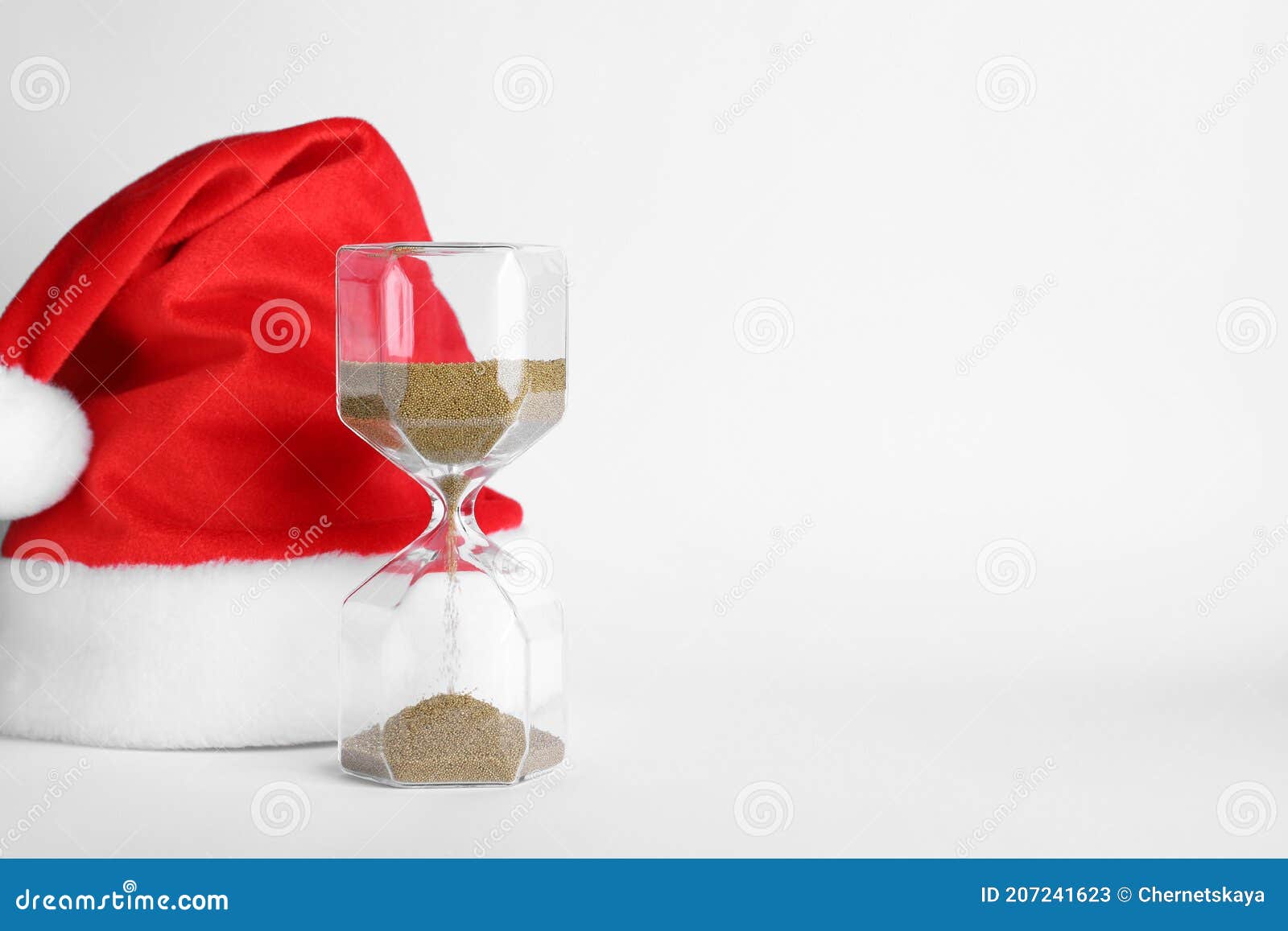 Hourglass and Santa Hat on White Background. Christmas Countdown Stock ...