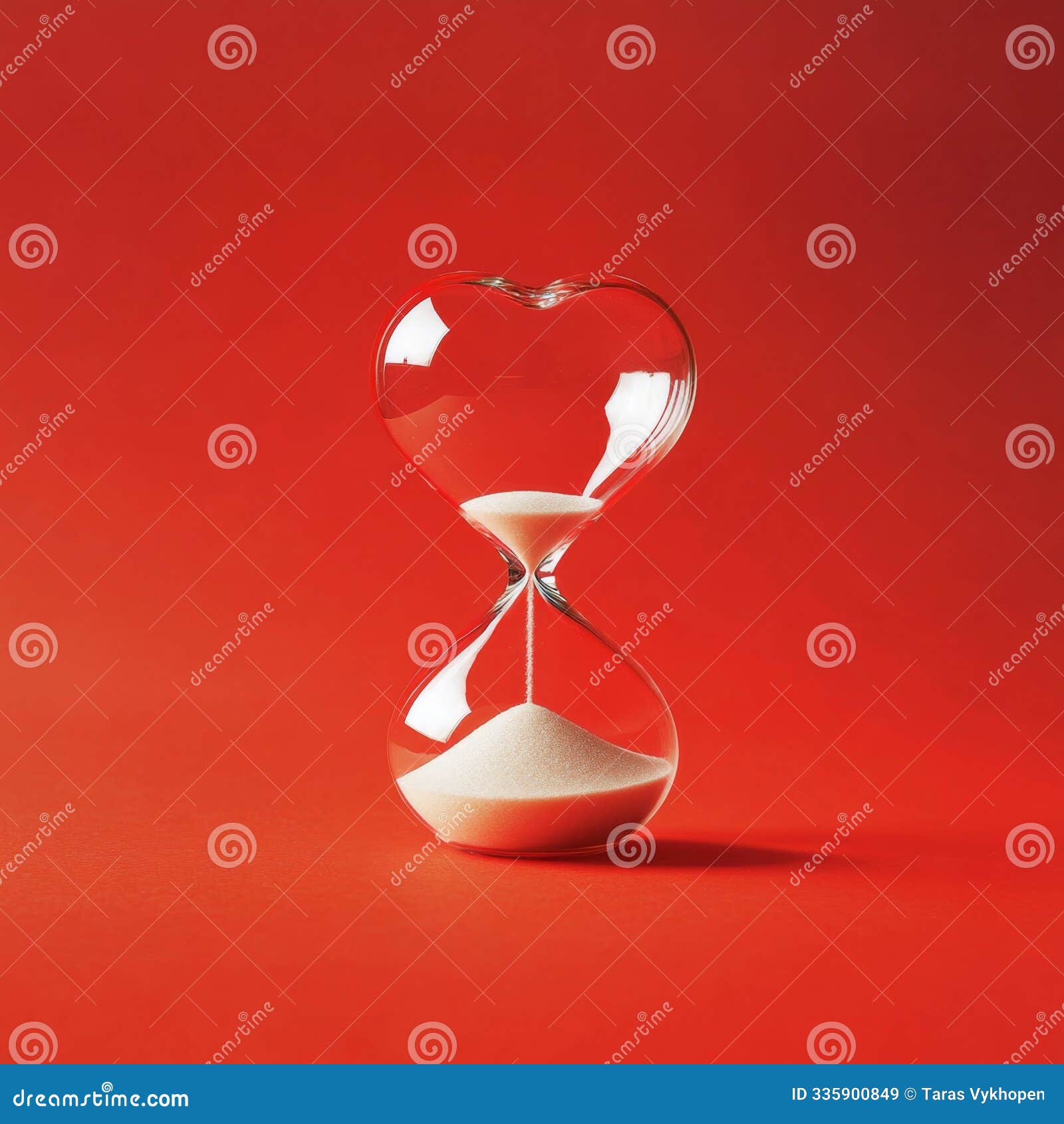 Heart-shaped Hourglass with Clear Sand Against a Red Gradient ...