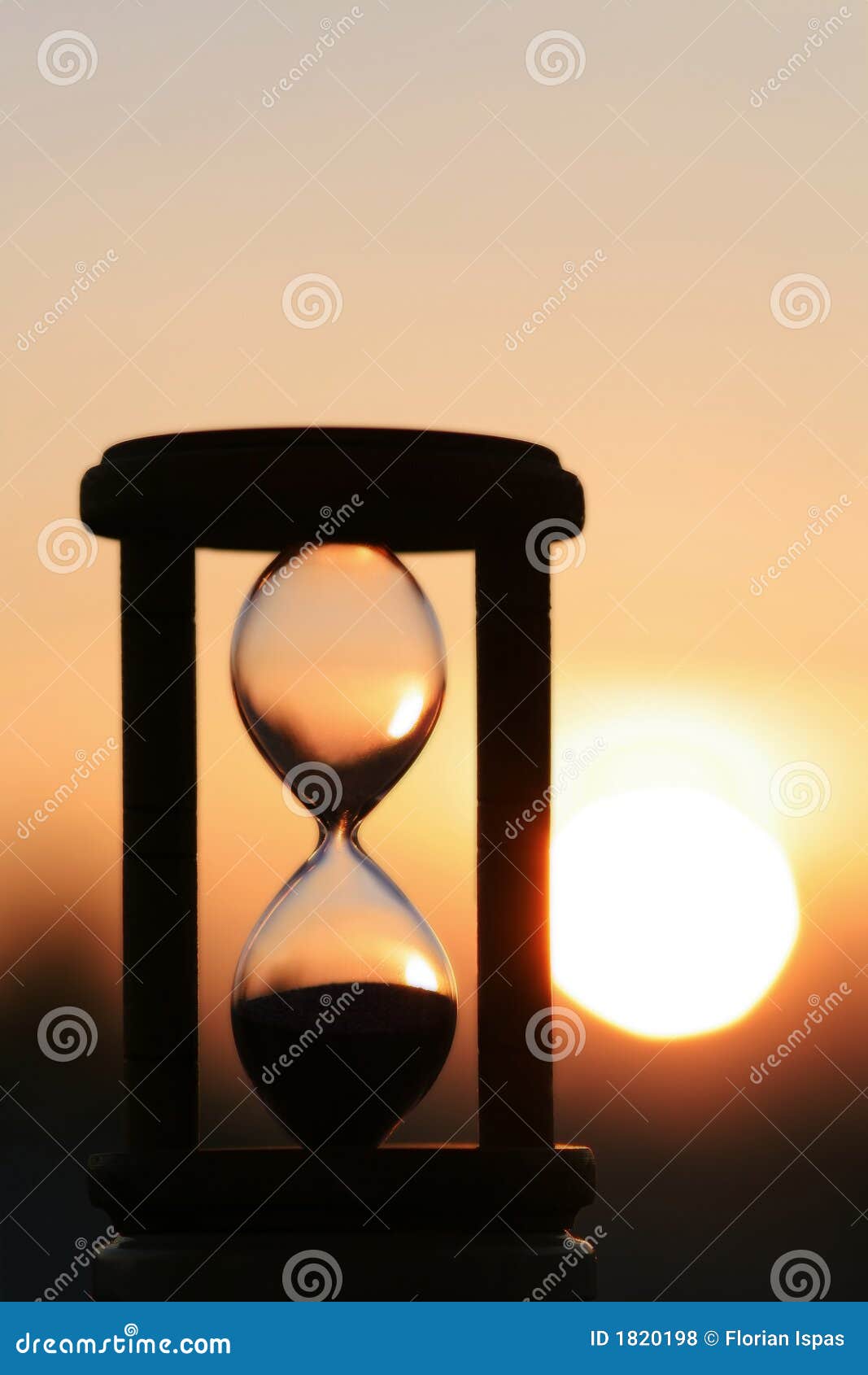 Hourglass in sunset stock photo. Image of transparent - 1820198