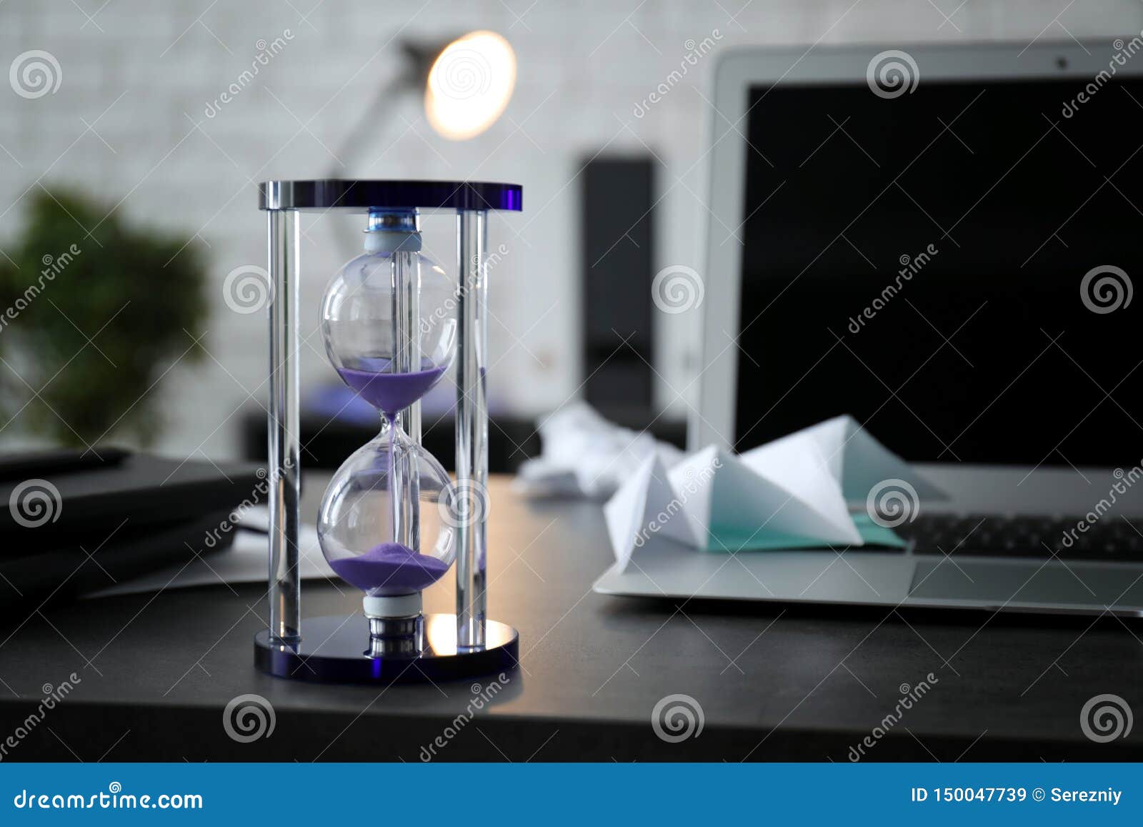 Hourglass on Table in Office. Time Management Concept Stock Image ...