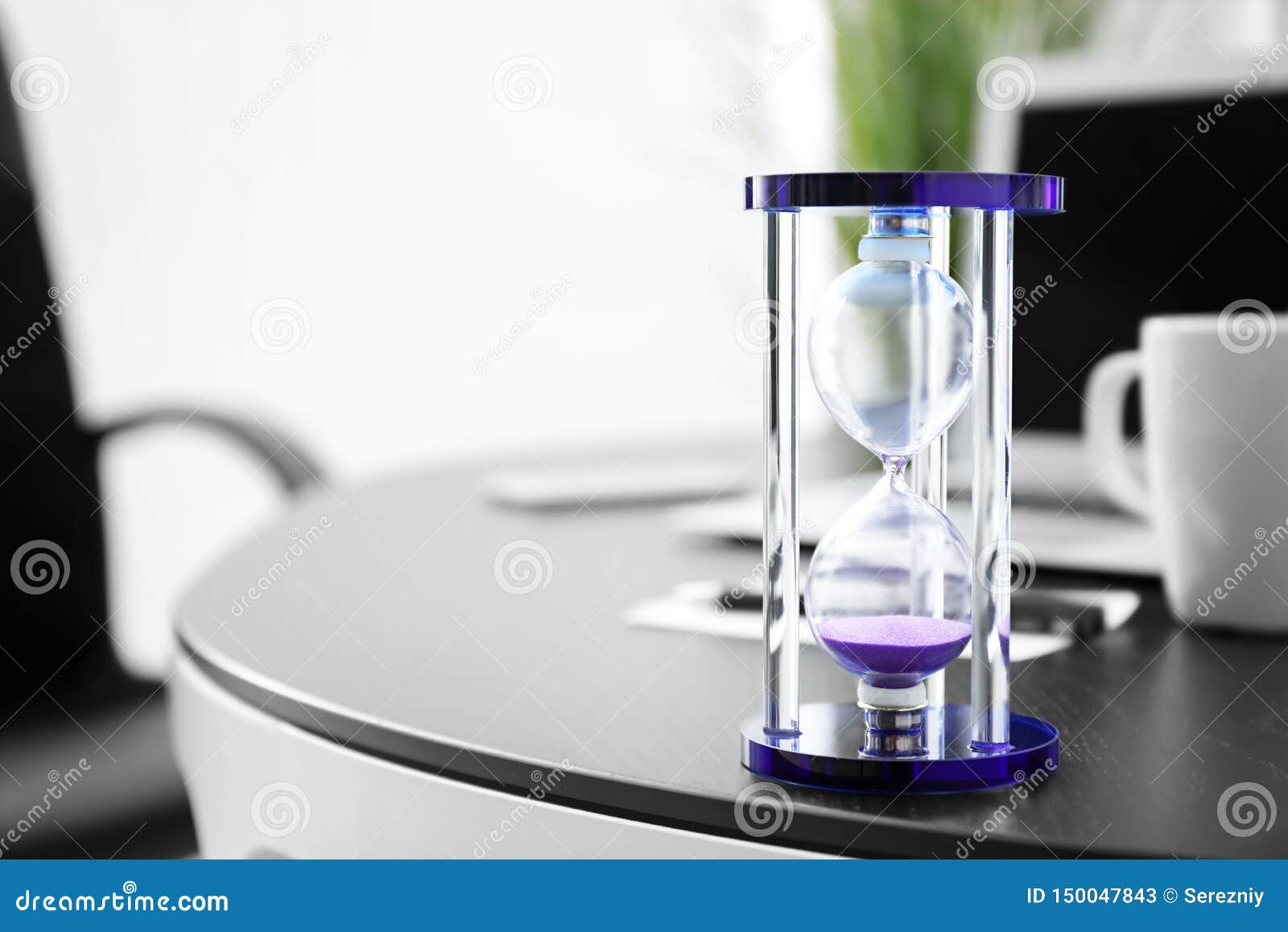 Hourglass on Table in Office. Time Management Concept Stock Image ...