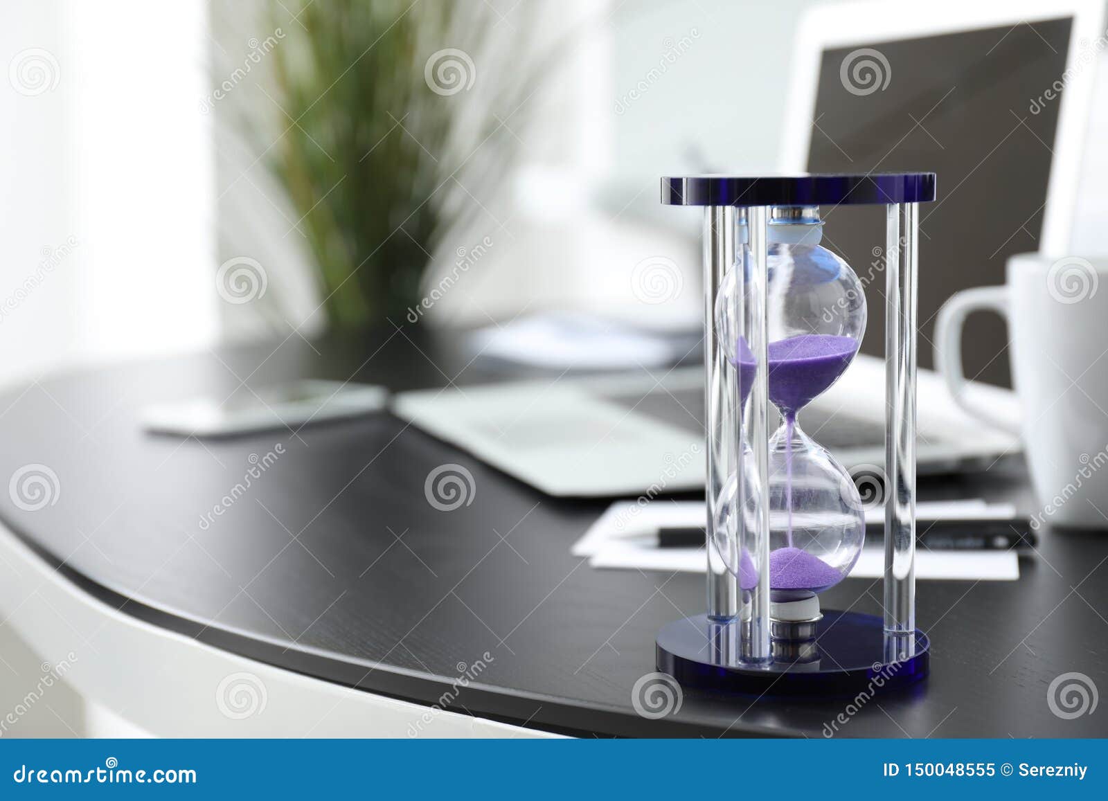Hourglass on Table in Office. Time Management Concept Stock Image ...