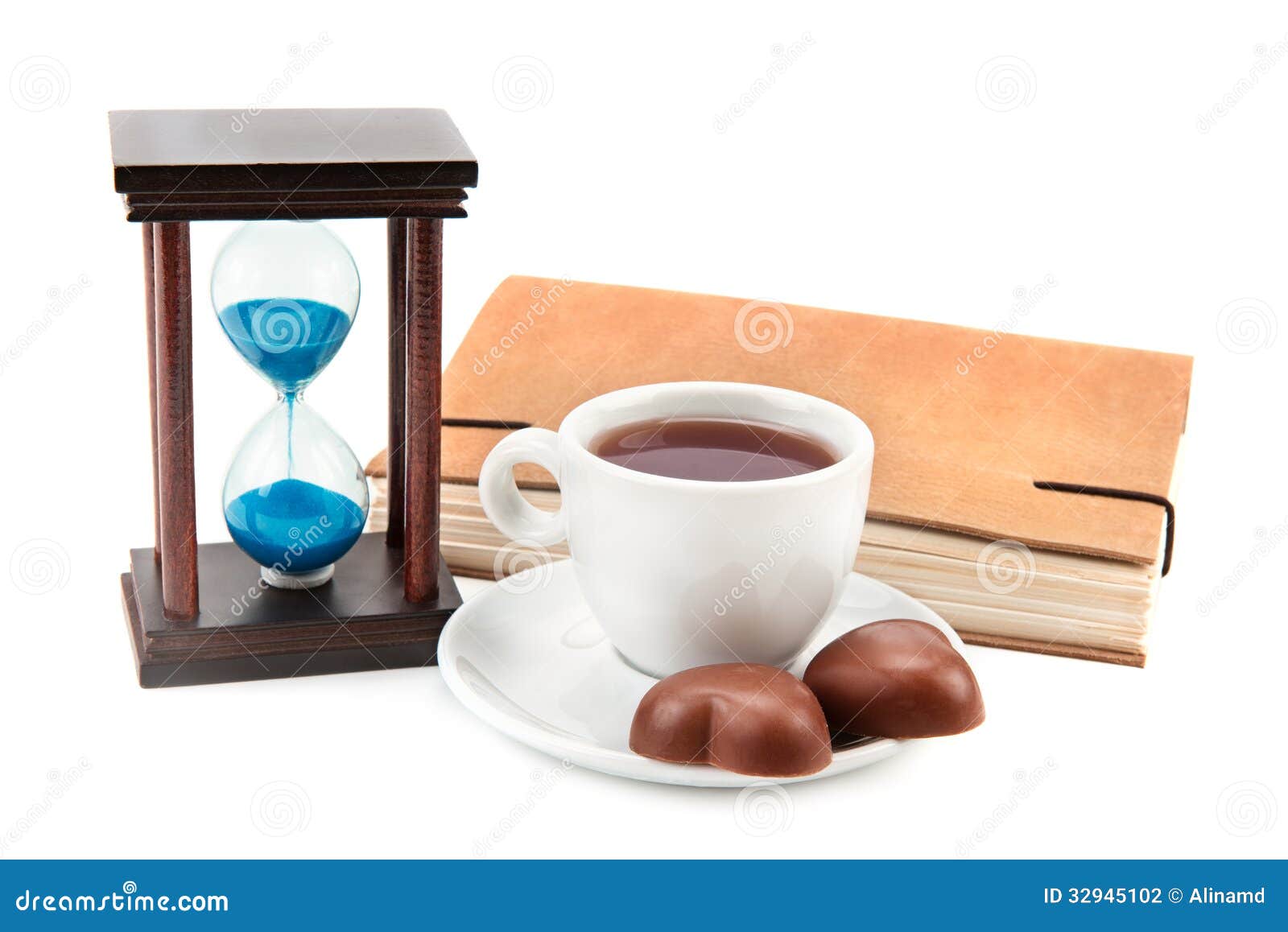 Hourglass tea cup and book stock photo. Image of chocolate - 32945102