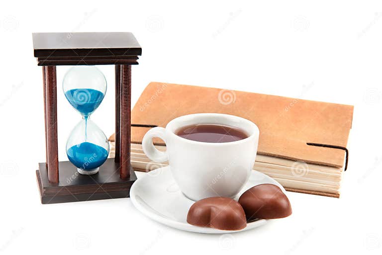 Hourglass tea cup and book stock photo. Image of chocolate - 32945102