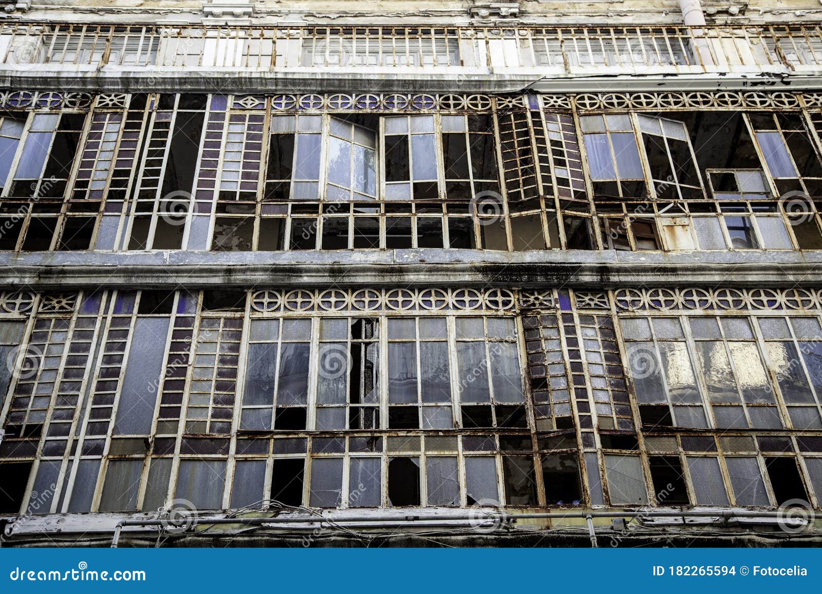 House with broken windows stock photo. Image of town - 182265594