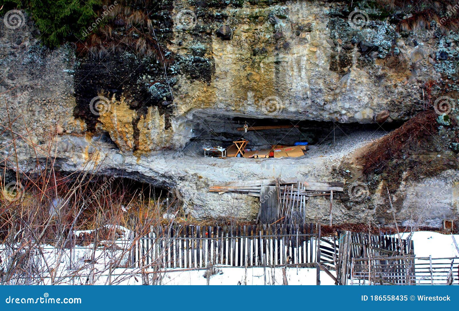 House Built Inside a Big Cave during Winter Stock Image - Image of ...