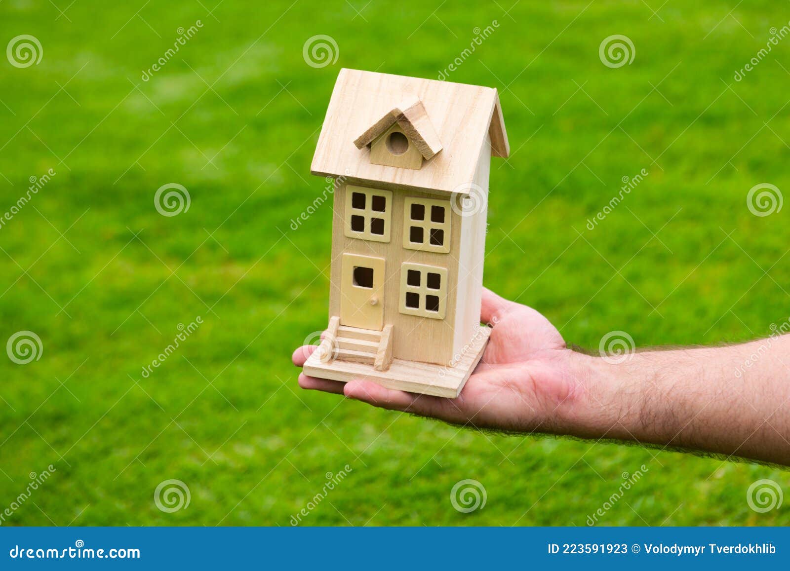 House In Caring Female Hands. Man Holding Wooden Model House In Hands ... House In Caring Female Hands. Man Holding Wooden Model House In Hands ...