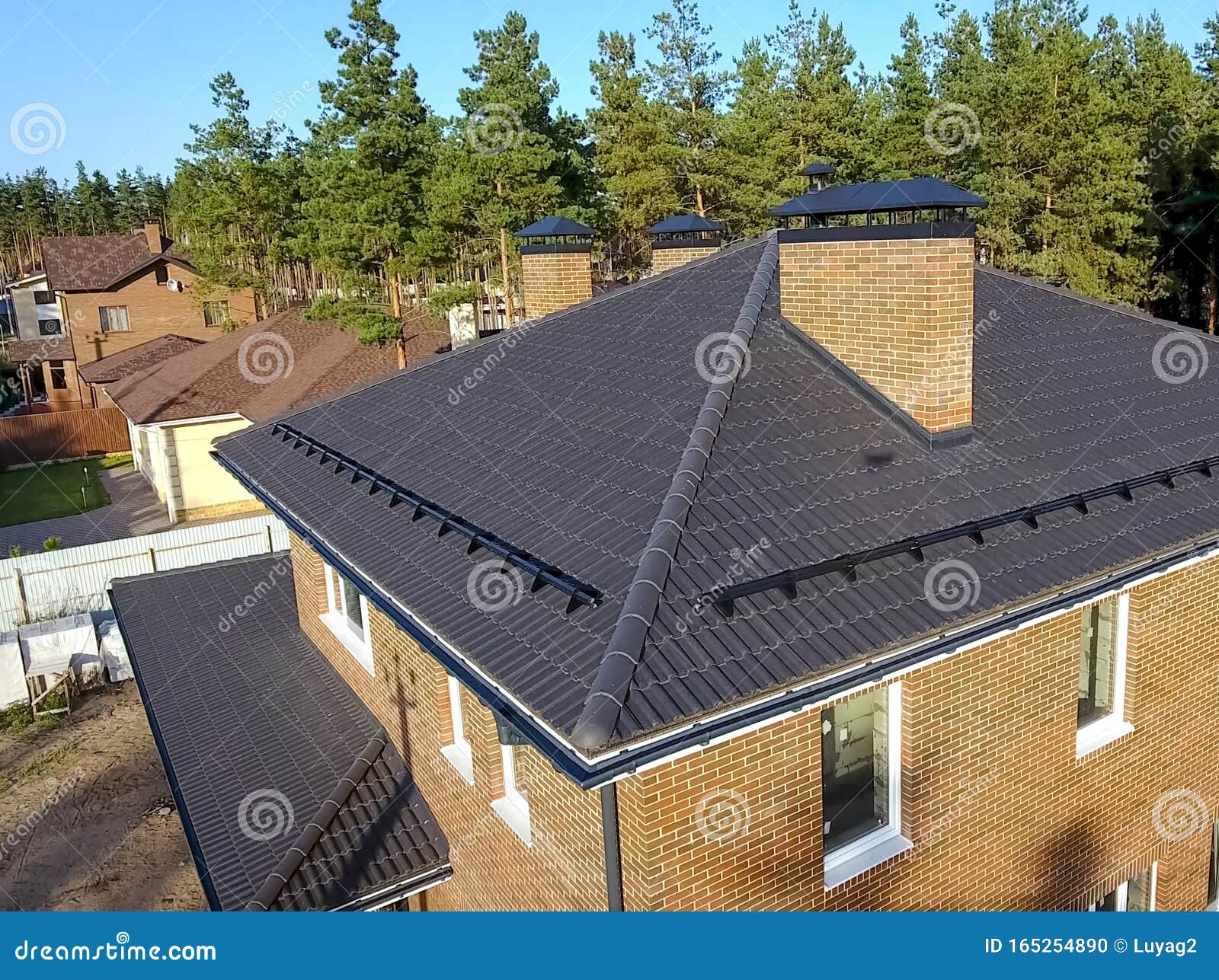 House with Ceramic Tile Roof. Cement-sand Roof Tiles Stock Photo ...