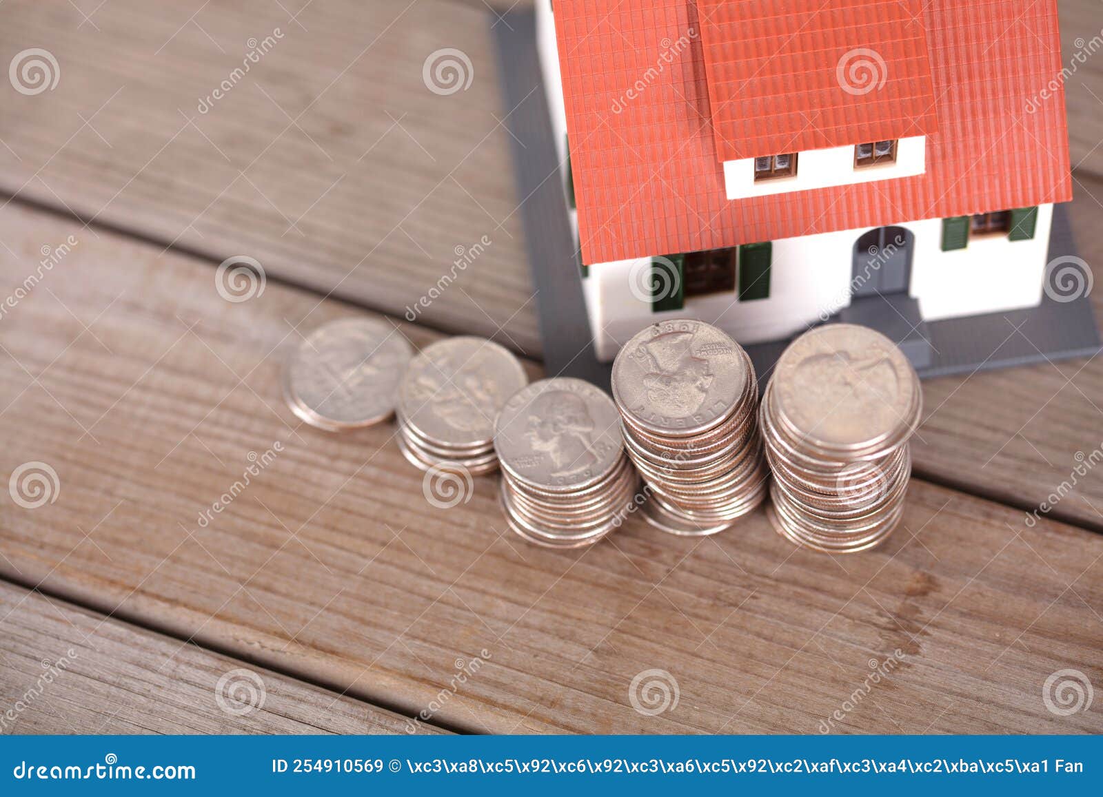 House and coins on table stock image. Image of prices - 254910569