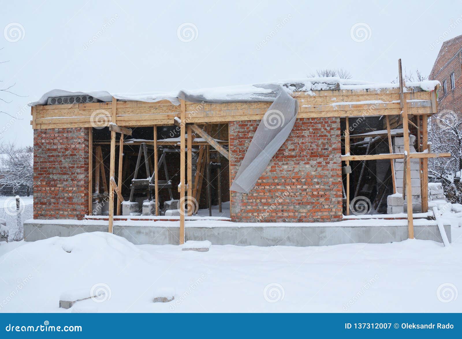 House Construction Site in Winter. Building House Construction during ...