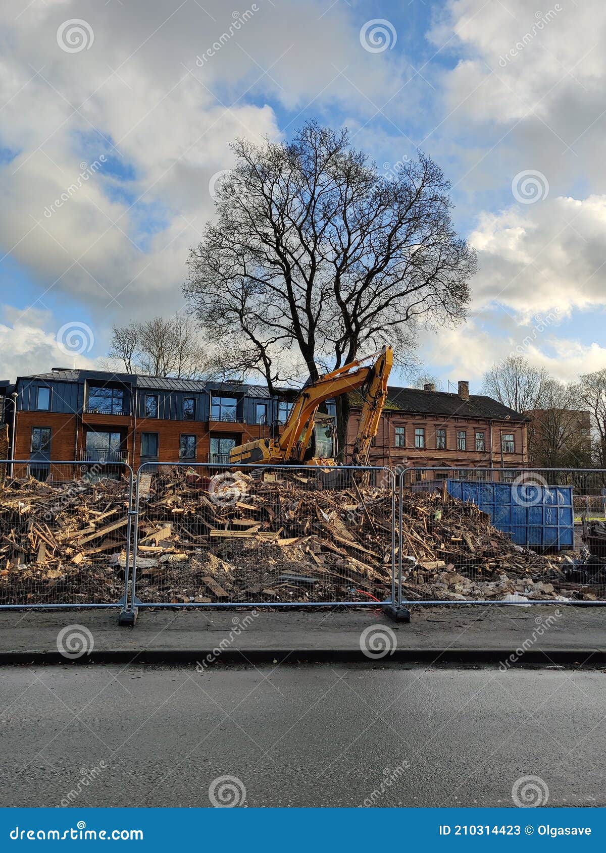 House Demolition Using an Excavator. Bulldozer Crushing an Old Building ...