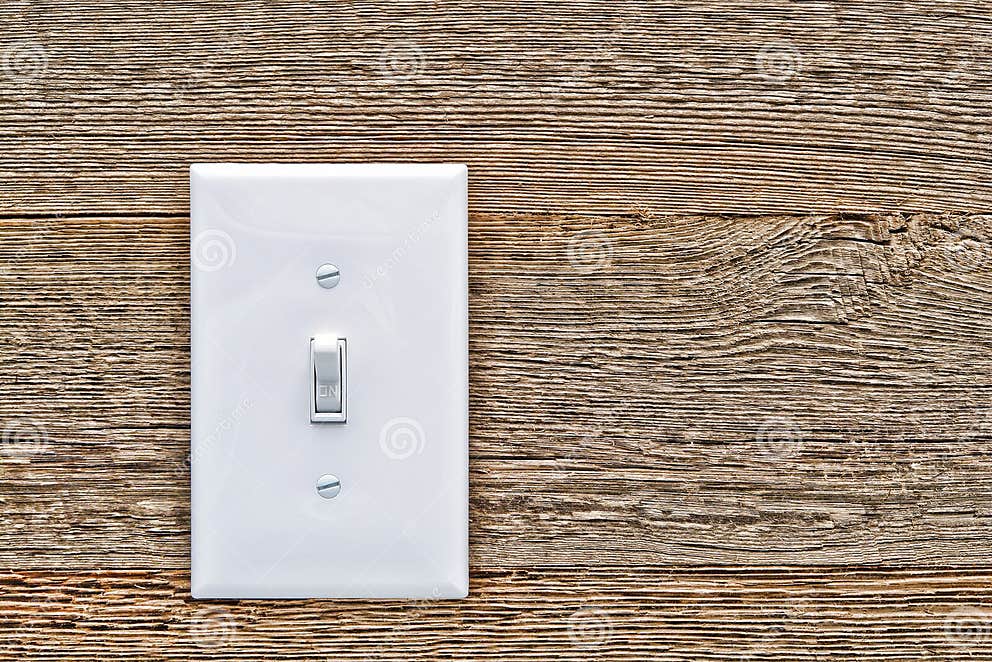 House Electric Light Switch in on Position on Wood Stock Photo - Image ...