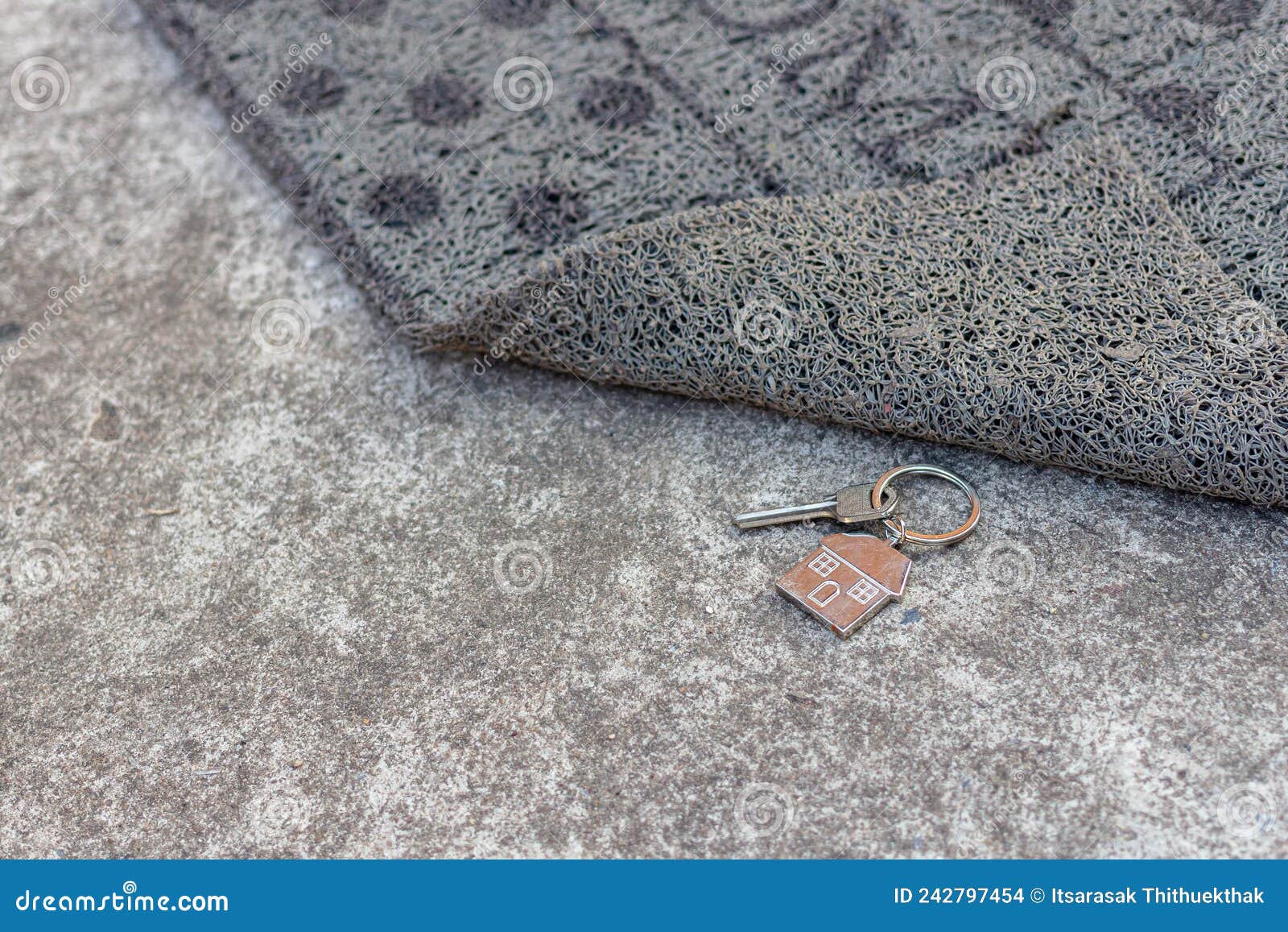 House Key Hidden Under Doormat in a Front of House Stock Photo - Image ...