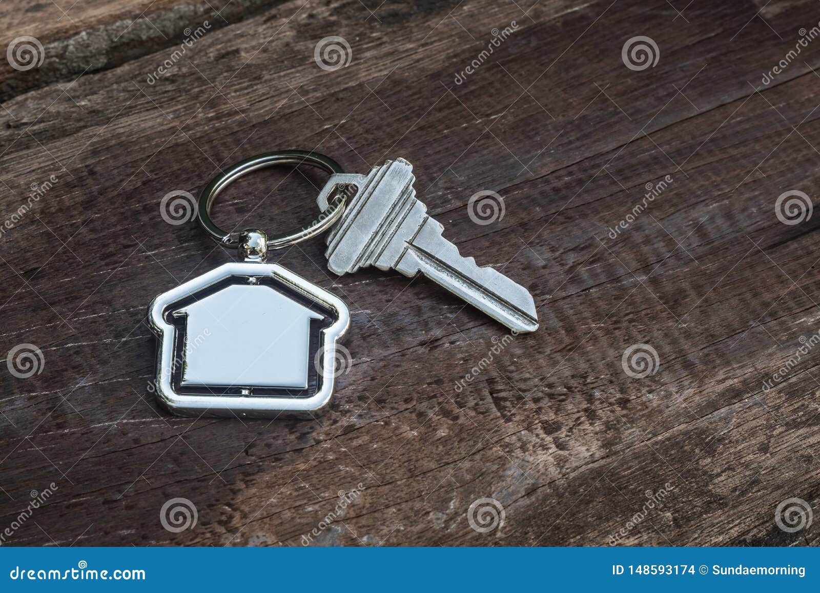 House Key with Home Keyring in on Old Wood Background Stock Photo ...