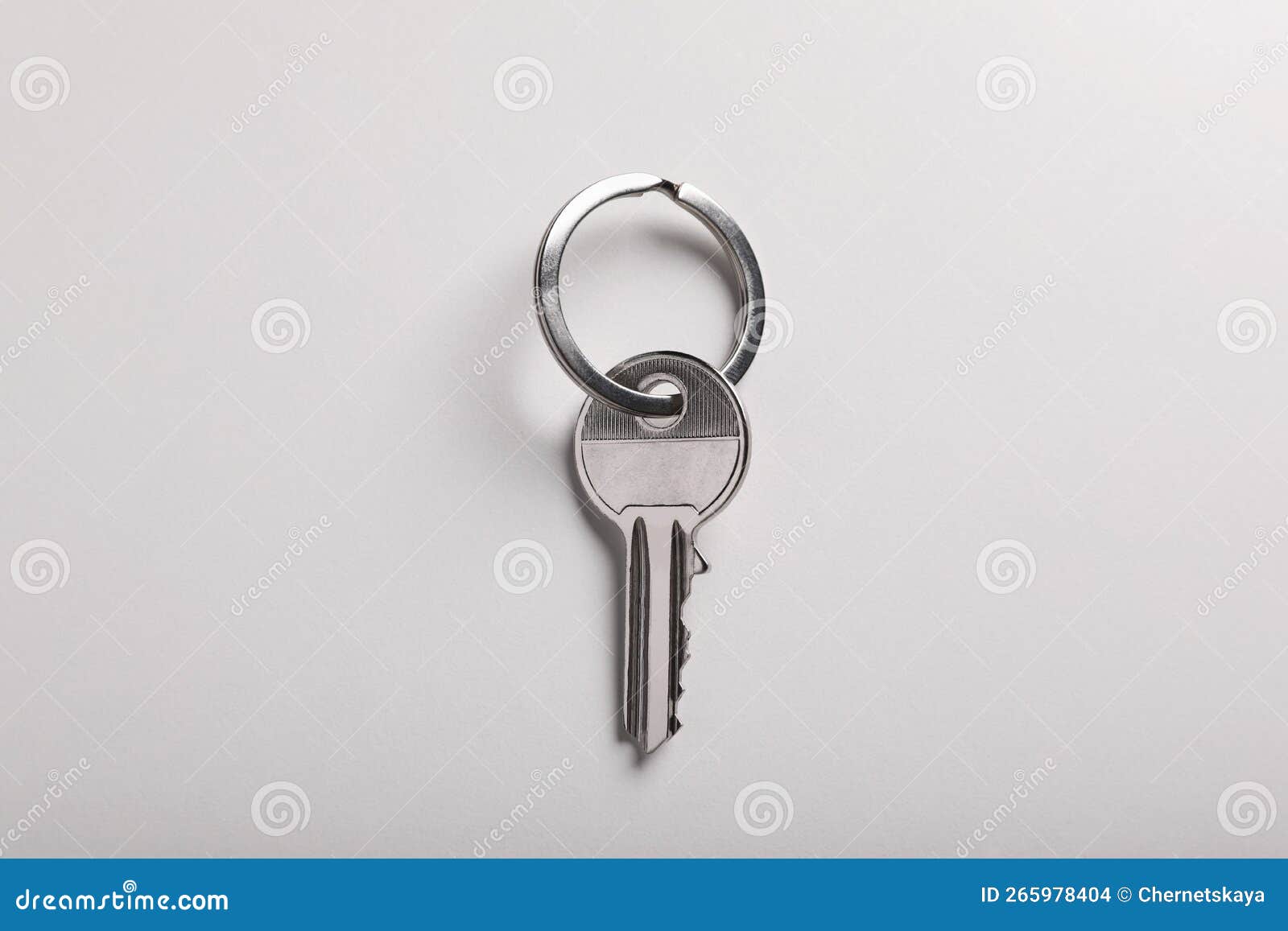 House Key on Light Grey Background, Top View. Real Estate Agent ...